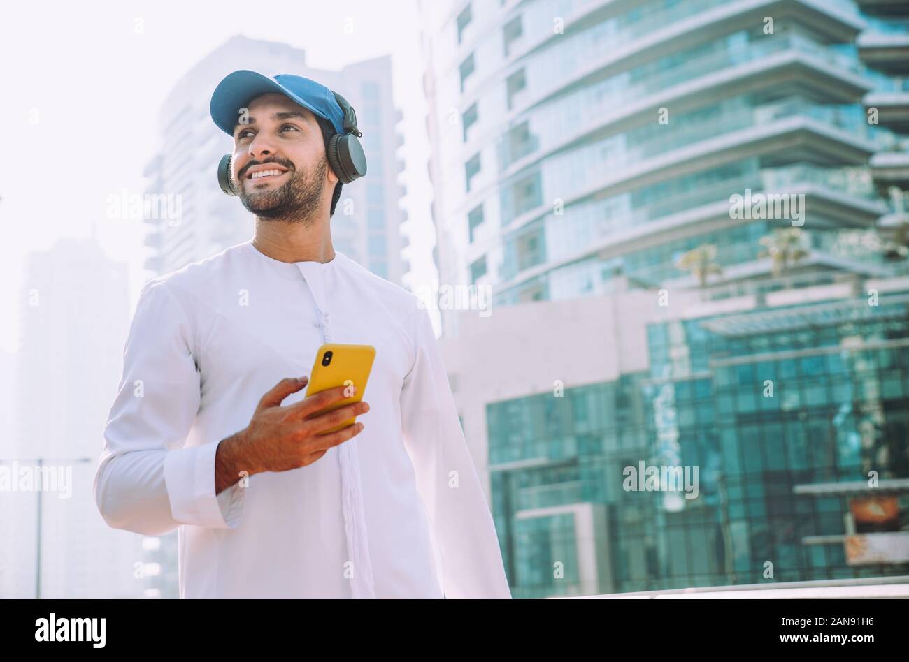 Beautiful middle eastern man wearing kandora traditional outfit in ...