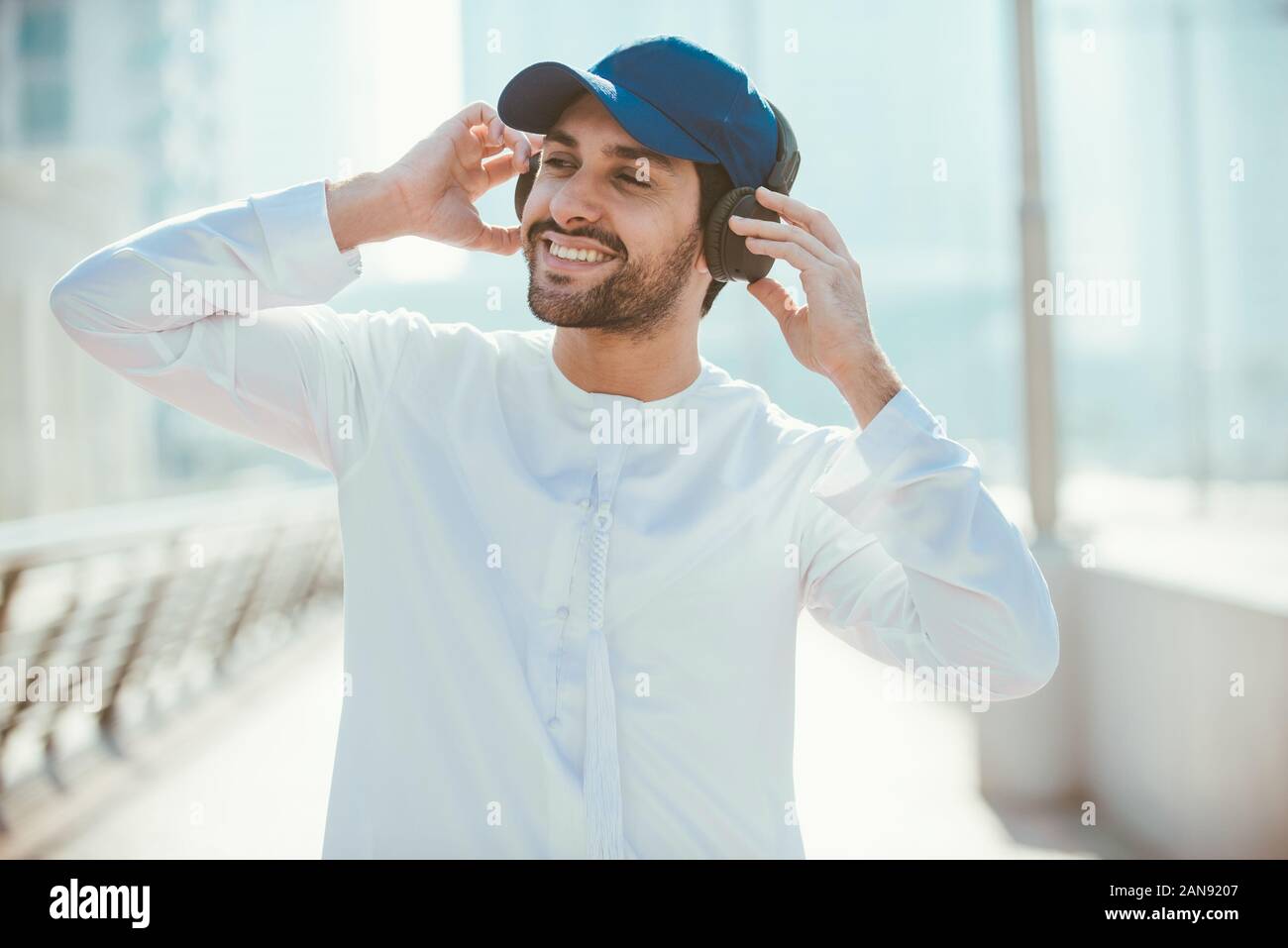 Beautiful middle eastern man wearing kandora traditional outfit in ...