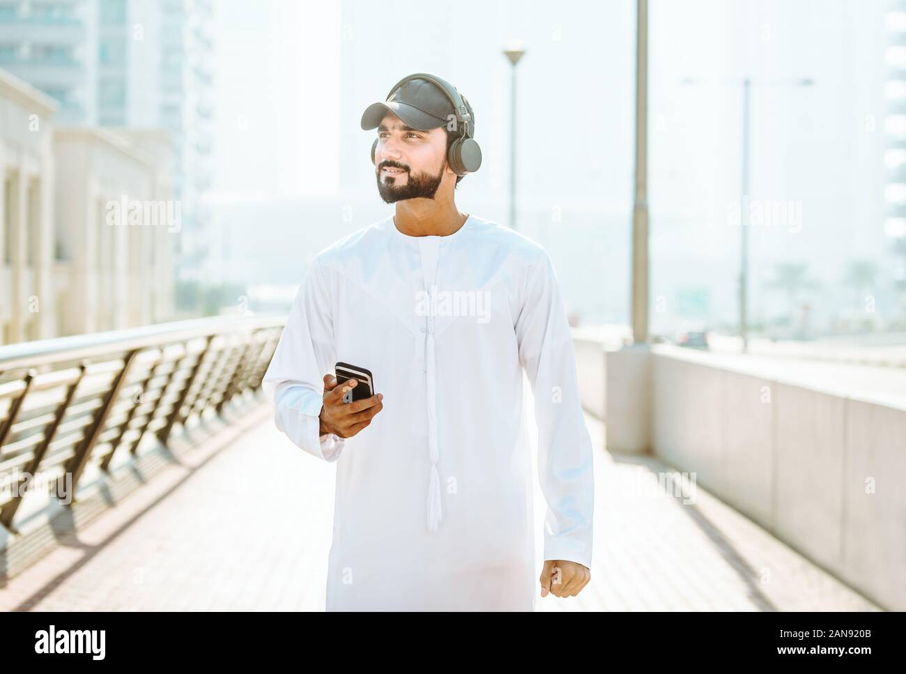 Beautiful middle eastern man wearing kandora traditional outfit in ...