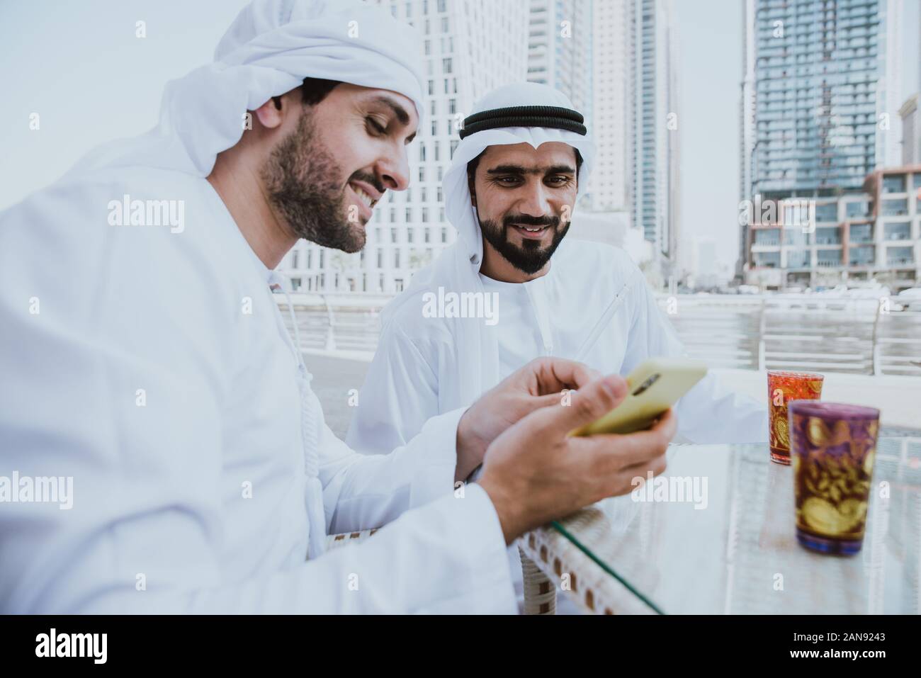 Beautiful middle eastern man wearing kandora traditional outfit in ...