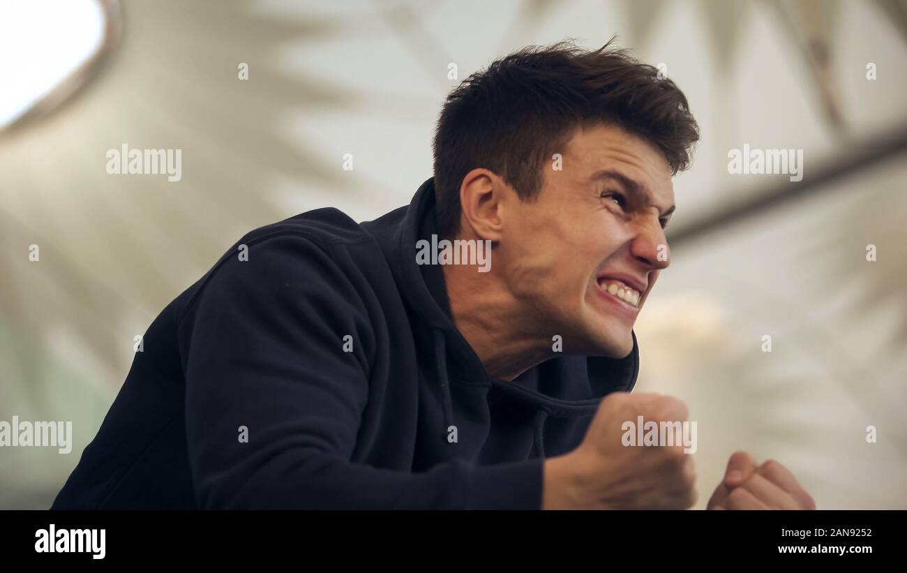 Young man suffering from stomach disorders, chronic constipation ...