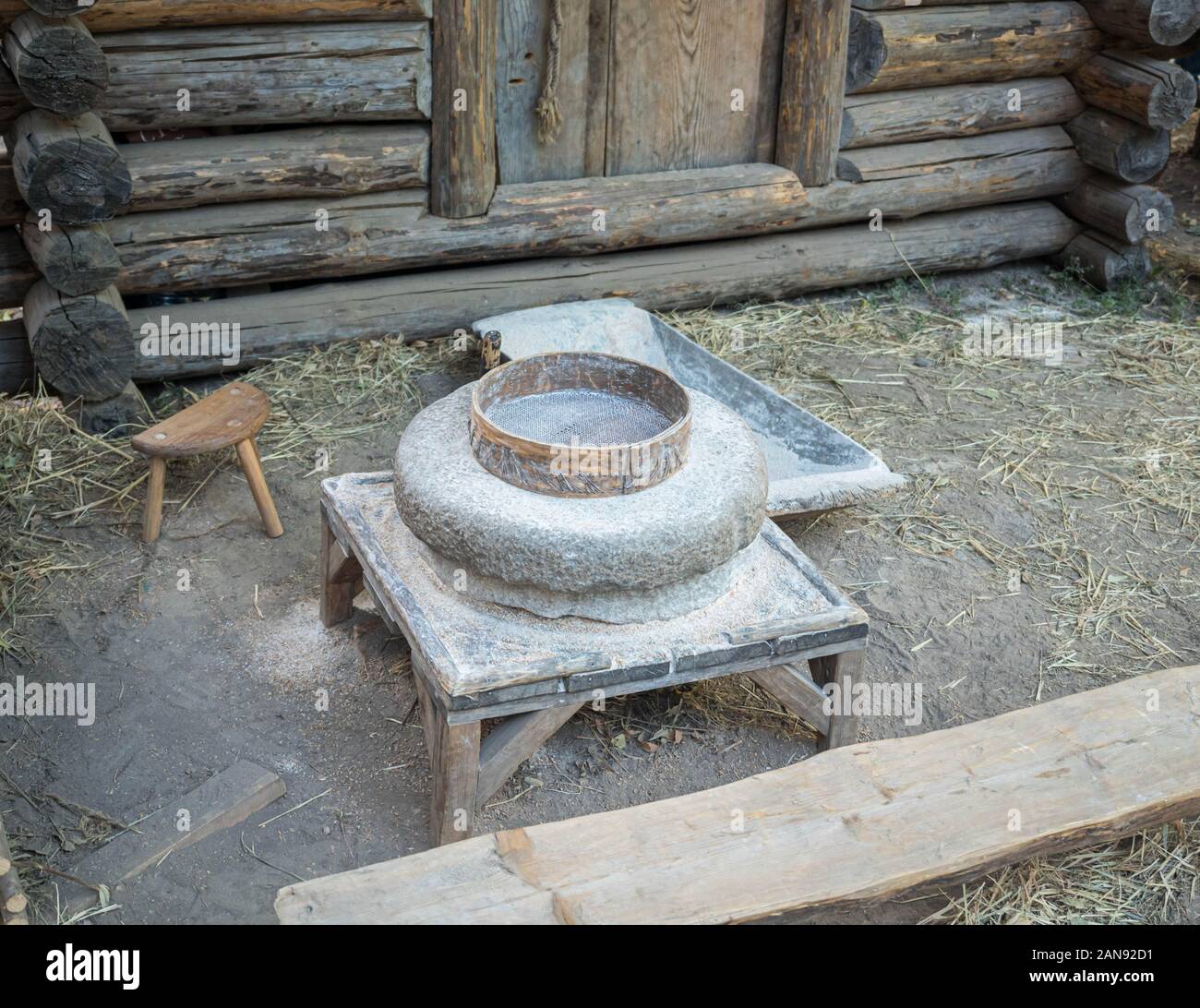 Rotary discoid mill stone for hand-grinding a grain into flour ...