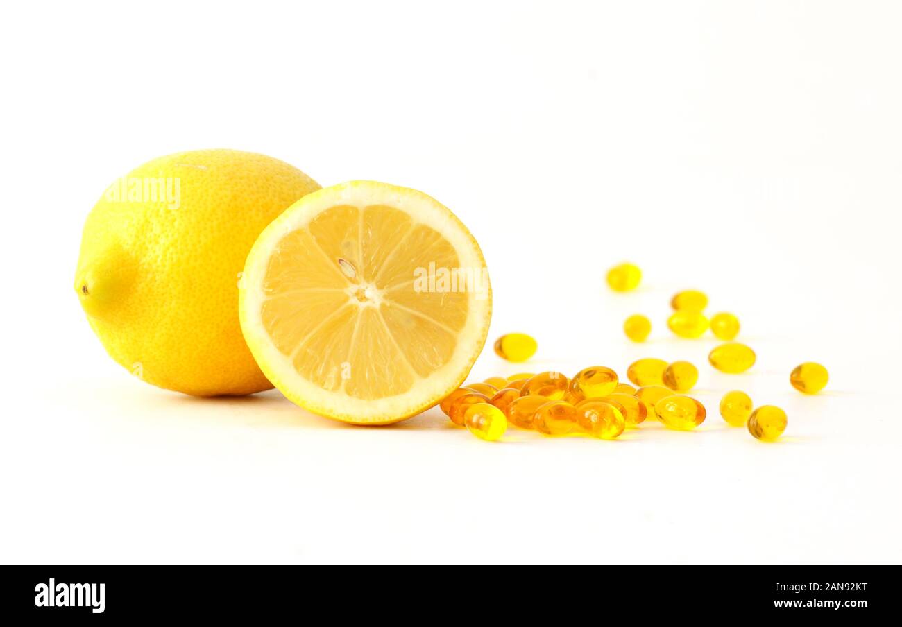 Lemon and pills - vitamin c nutrition supplements Stock Photo - Alamy