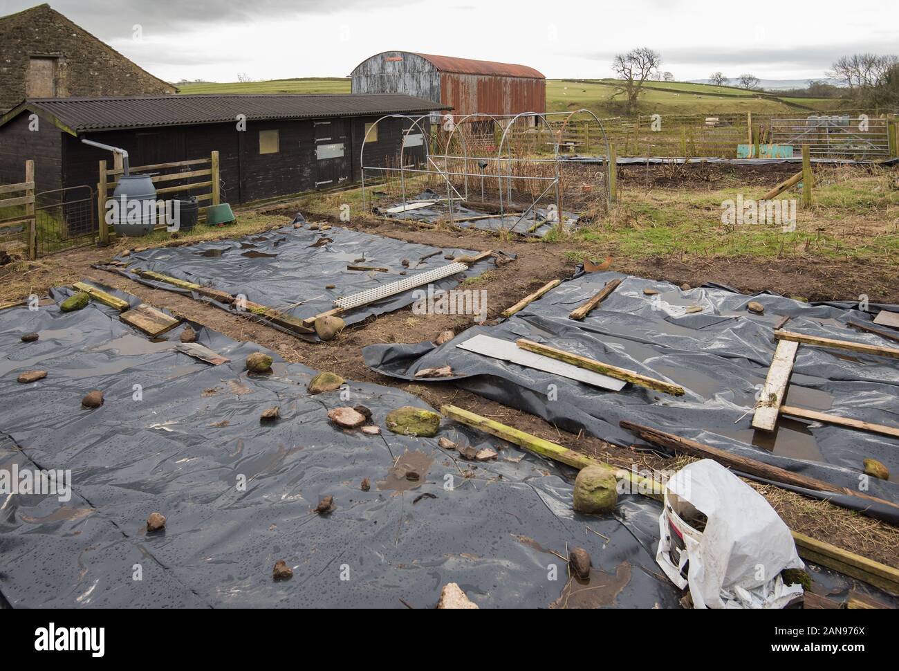 Ground clearance using polythene plastic Stock Photo - Alamy
