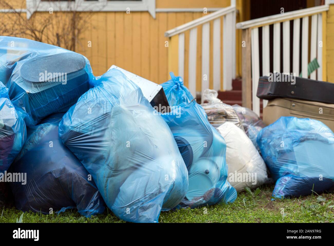 Garbage in plastic bags placed in the yard, outdoor shot Stock Photo ...