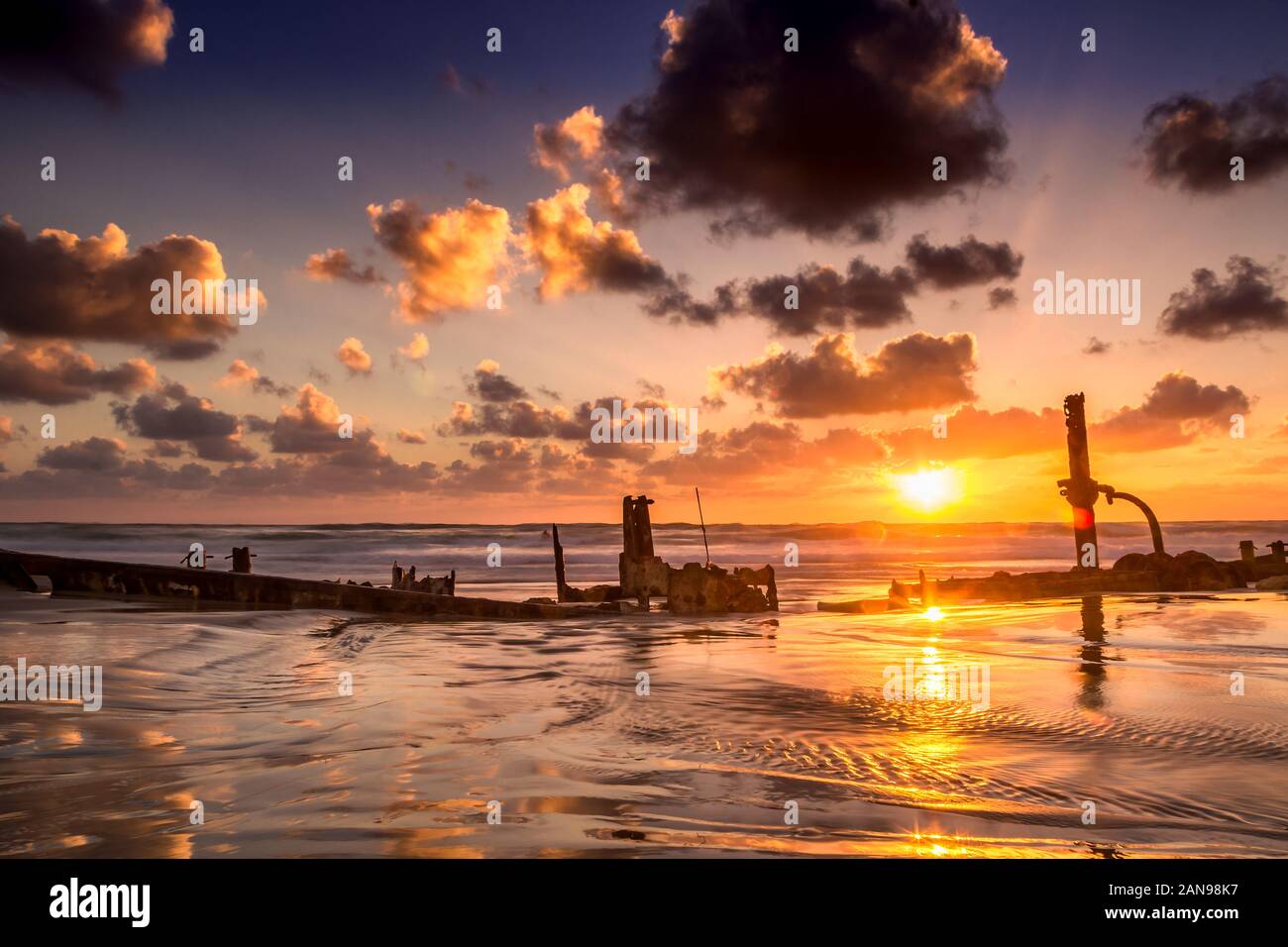 Sunken ship shot at sunset at Hof Dor, Israel Stock Photo - Alamy