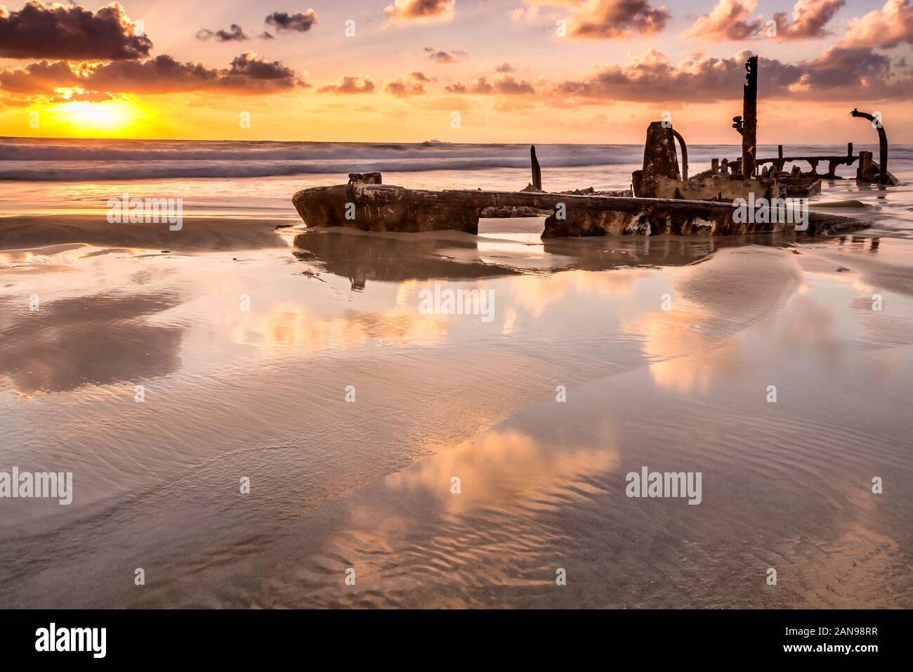 Sunken ship shot at sunset at Hof Dor, Israel Stock Photo - Alamy