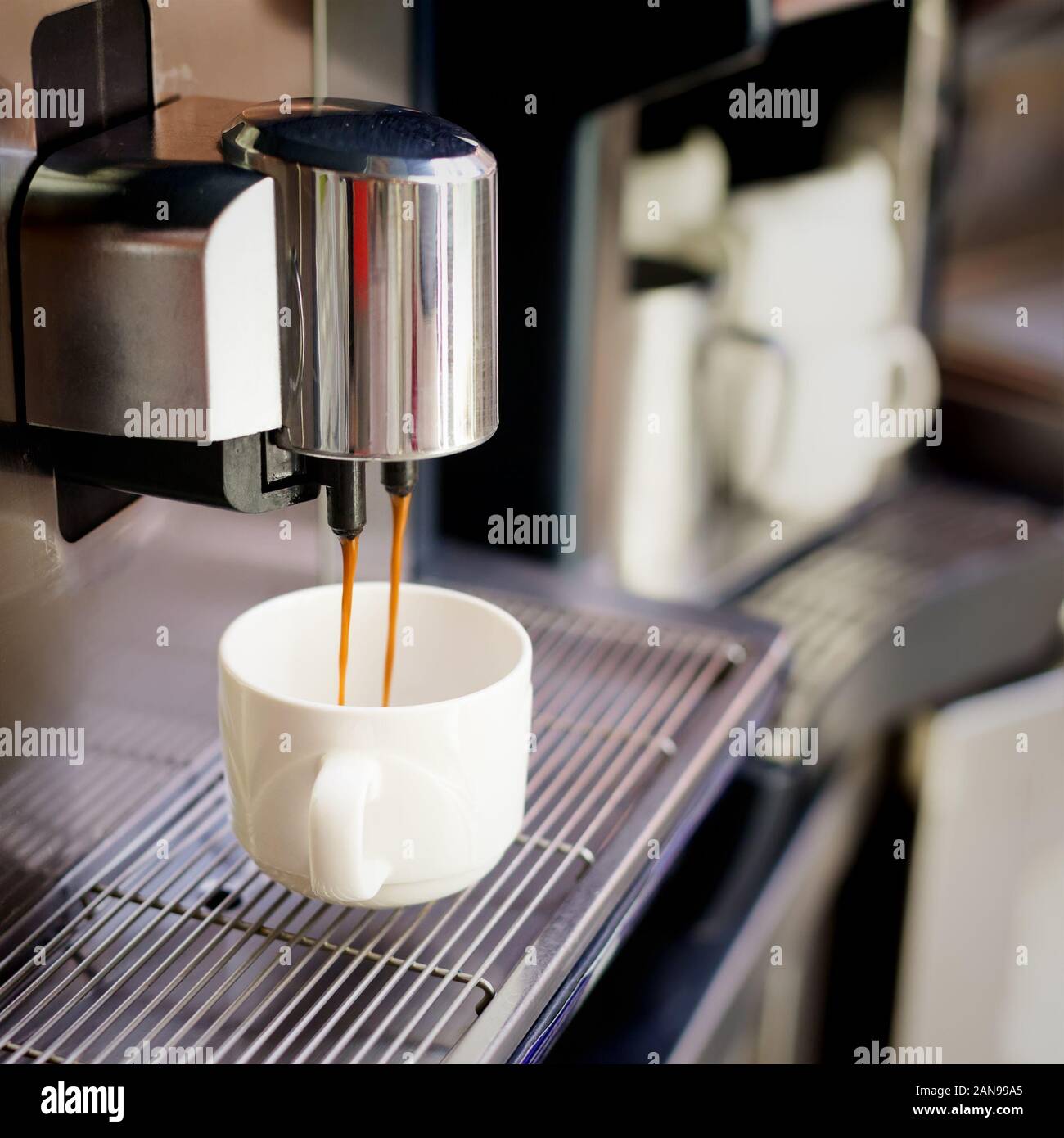 Preparation of coffee in a coffee machine Stock Photo - Alamy