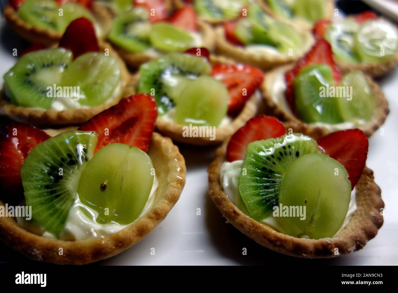 Small Fruit Tarts filled with Creme Patissiere in the Buffet at the ...
