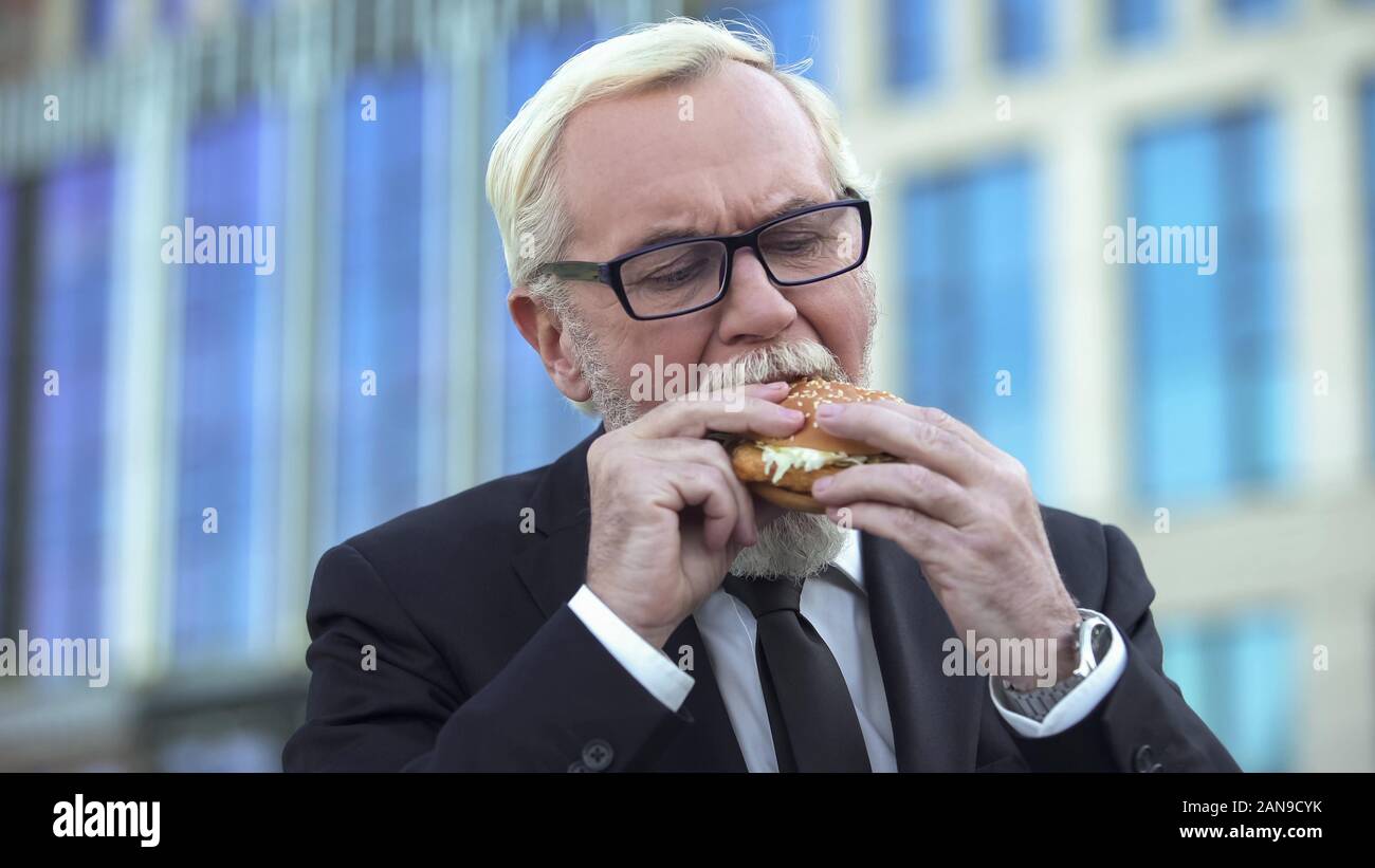 Fat man eating dinner suit hi-res stock photography and images - Alamy