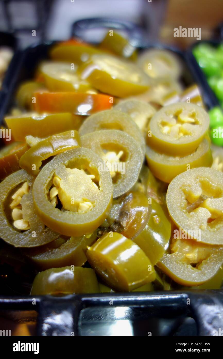 A Bowl of Sliced Green Jalapeño Chili Peppers (Capsicum Annuum) in the ...