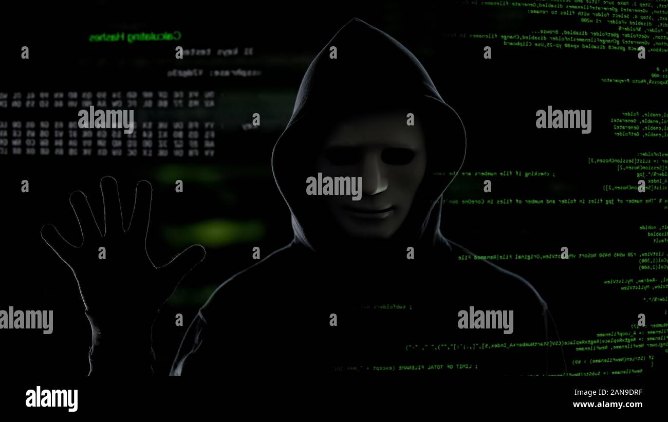 Male hacker on dark background start the hacking process, stealing ...
