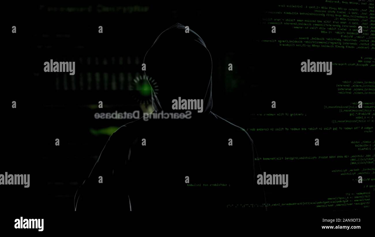 Anonymous hacker looking at virtual screen, stealing secret data, cyber ...