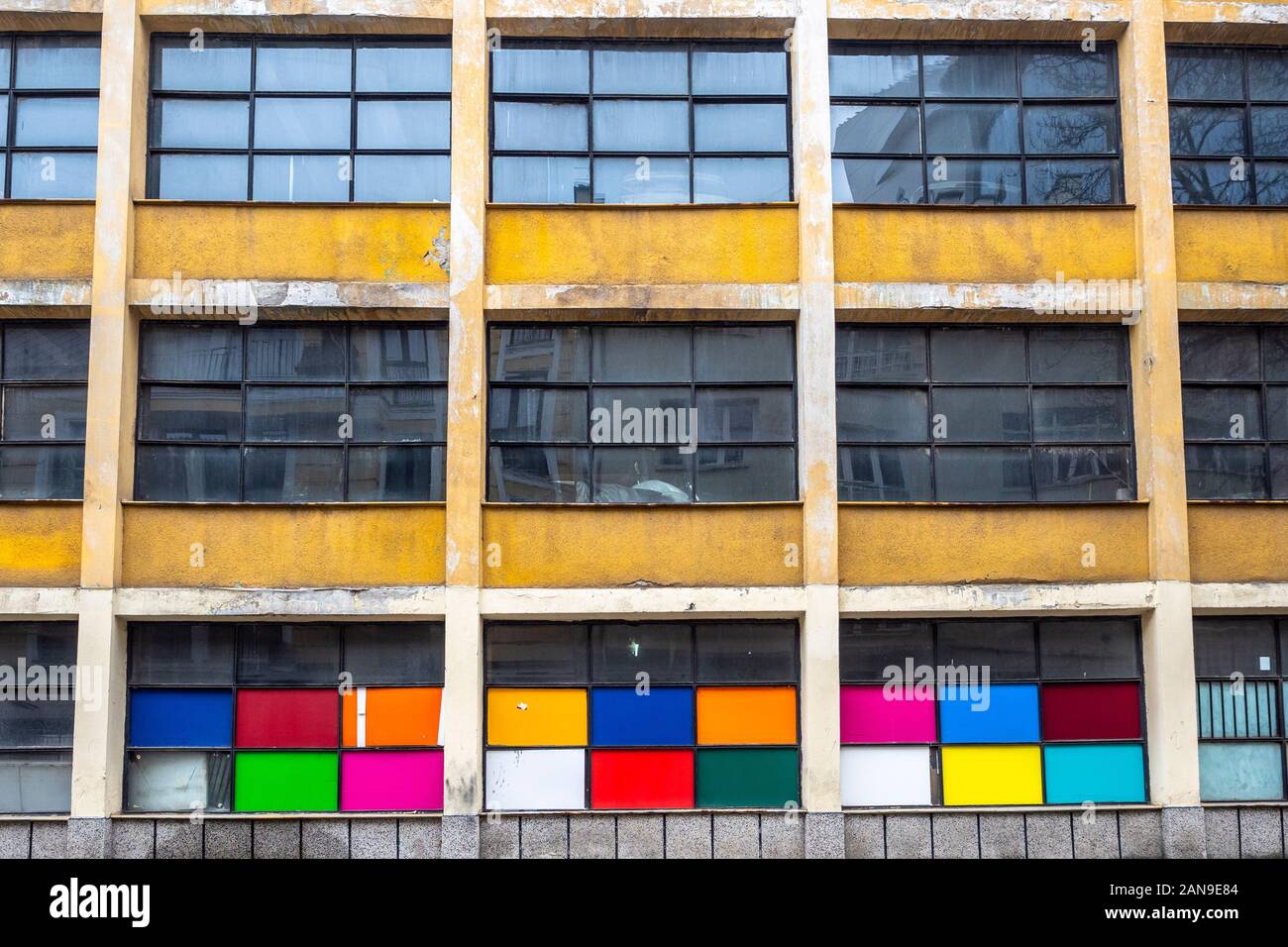 facade of an industrial building with colored windows Stock Photo - Alamy