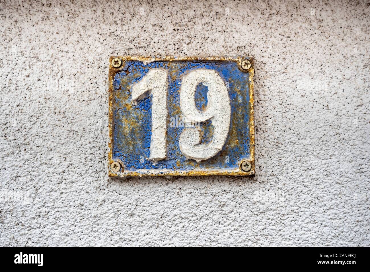 Number 19, nineteen, street number sign on the wall Stock Photo - Alamy