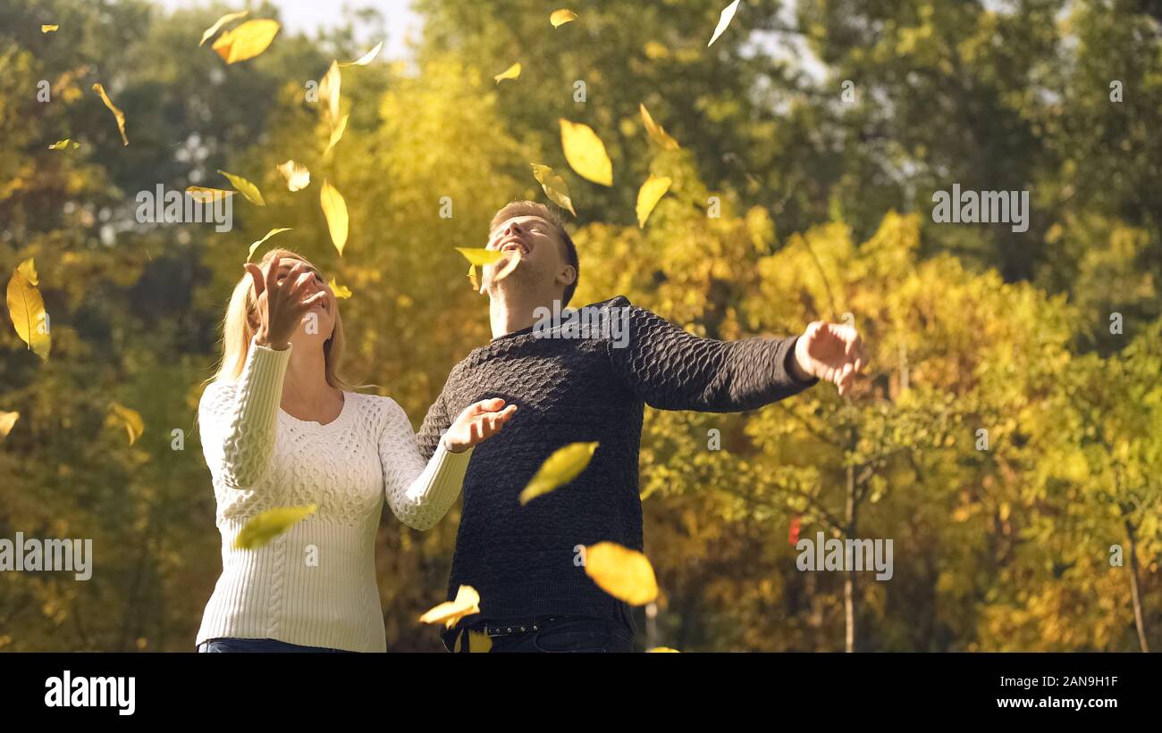Couple Throwing Leaves High Resolution Stock Photography and Images - Alamy