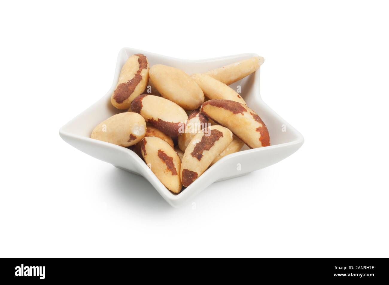 Nuts in small dish Cut Out Stock Images & Pictures - Alamy