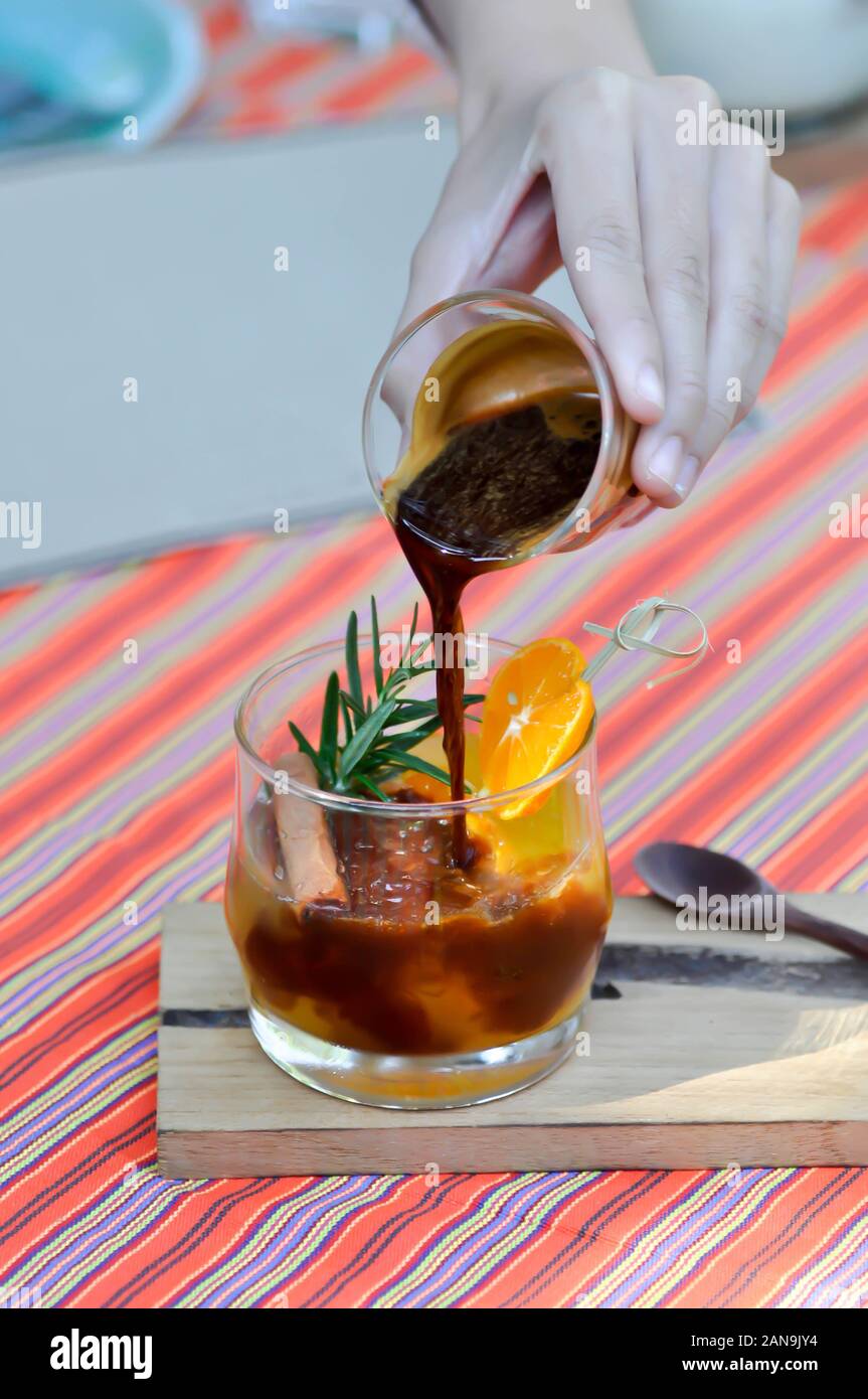 Pouring espresso orange juice hi-res stock photography and images - Alamy