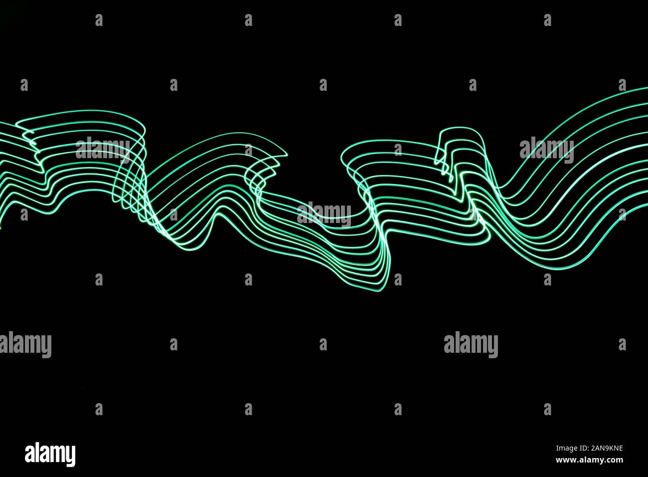 Long exposure light painting, vibrant green color in abstract parallel ...
