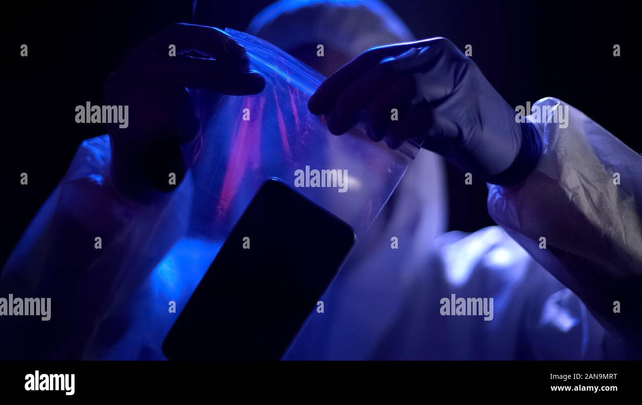 Forensic uniform hi-res stock photography and images - Alamy