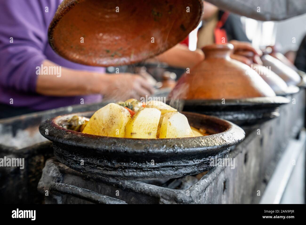 Delicious moroccan tajine prepared and served in clay pots, Marrakech ...