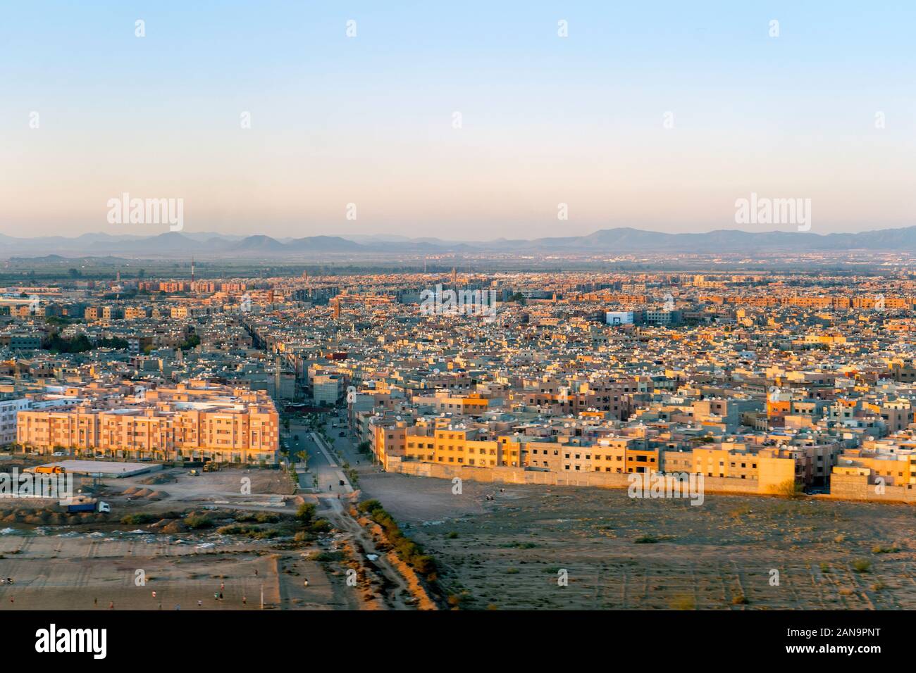 Aerial view of residential area of Marrakech with Atlas mountains on ...