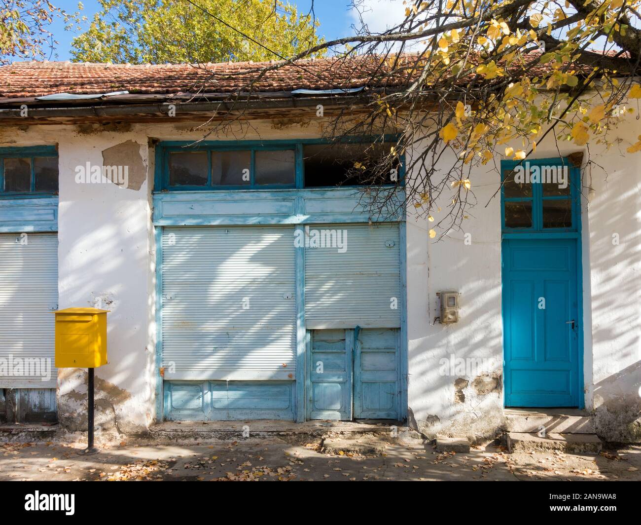 The facade of an old and abandoned store in Akritas village, Florina ...
