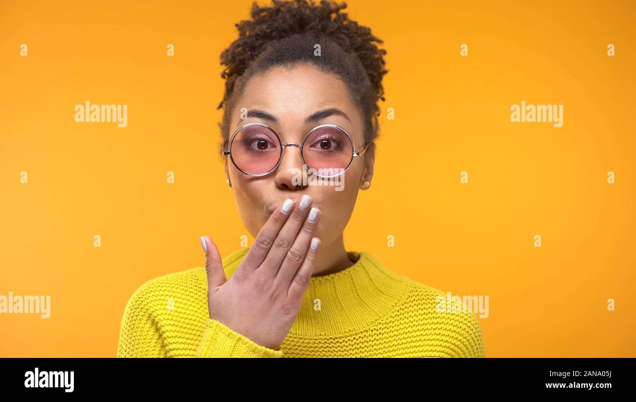 African woman hand cover mouth hi-res stock photography and images - Alamy