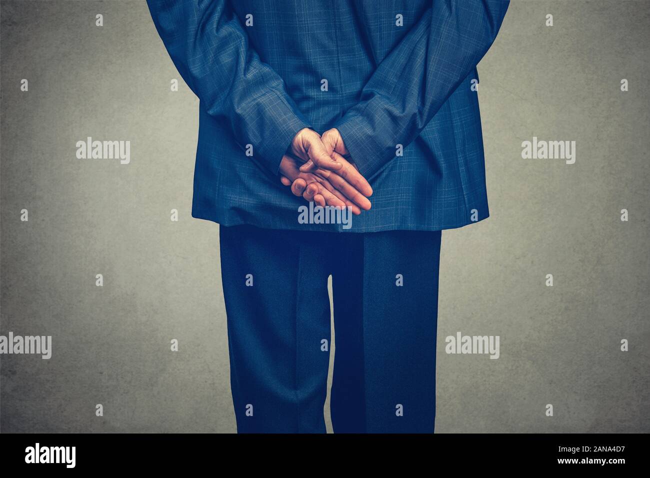 Hands clasped behind back hi-res stock photography and images - Alamy