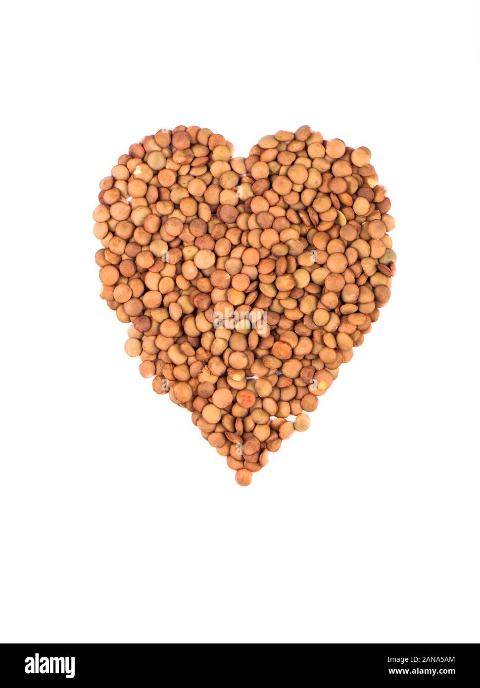 Heart shape made from lentils on a white background. Food pattern made ...