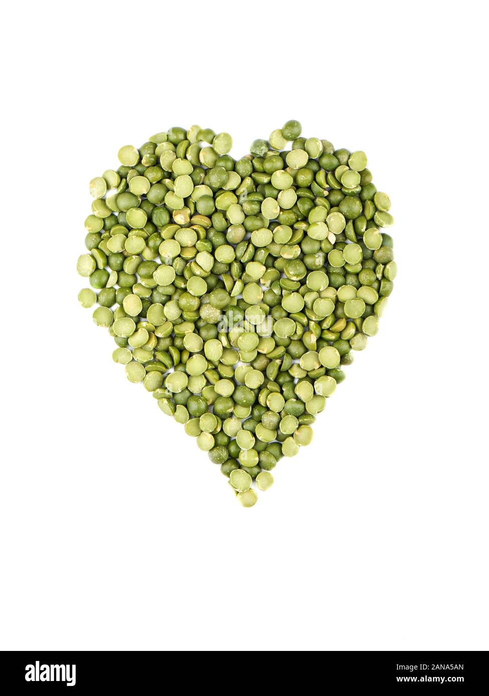 Heart shape made from green chopped peas on a white background. Food ...