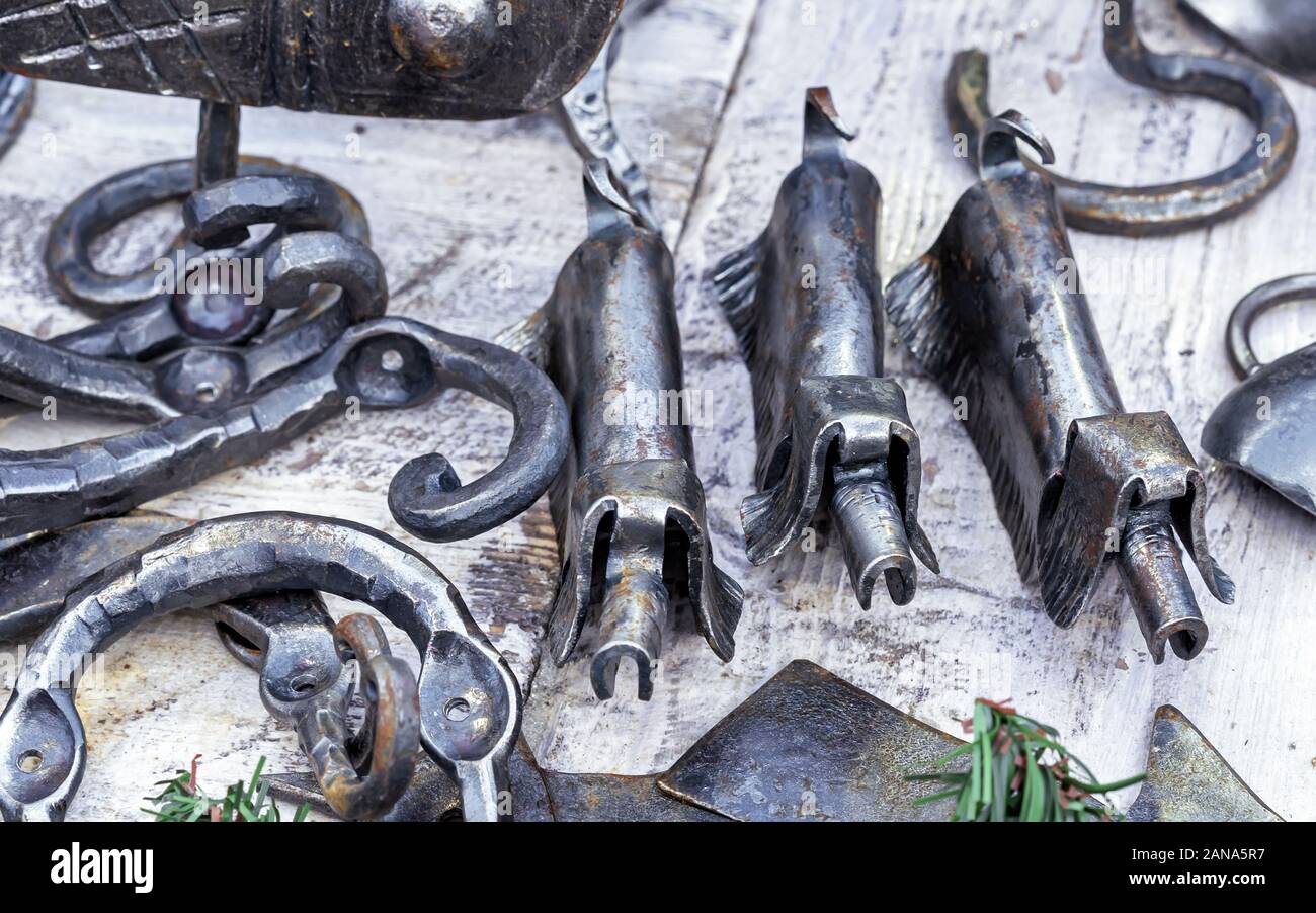 Figurines of three dogs of forged metal. Forged products of a ...