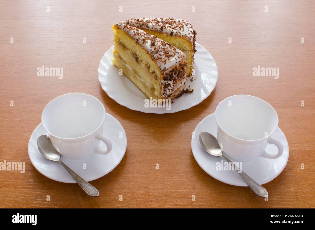 Two cups and pouring tea hi-res stock photography and images - Alamy
