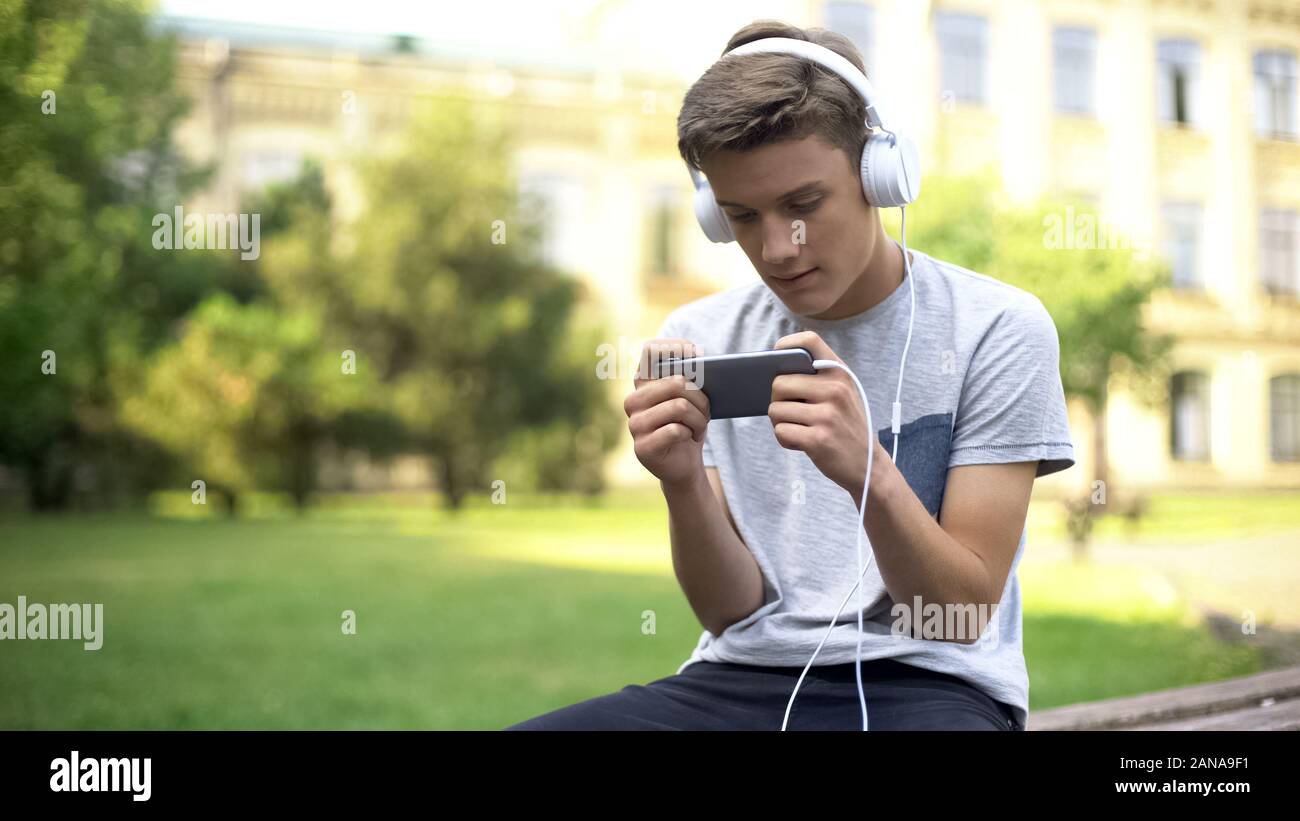 Male gamer playing mobile hi-res stock photography and images - Alamy