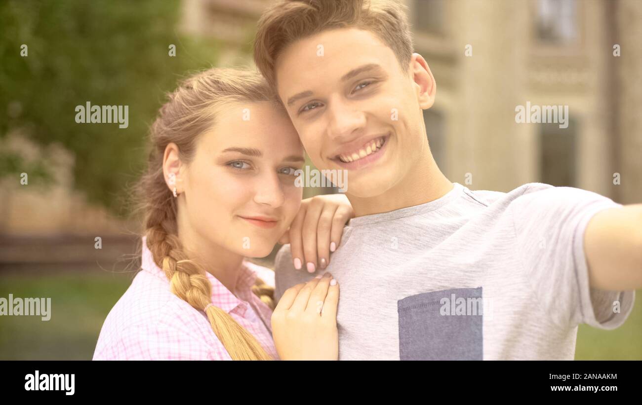 Cheerful teenagers smiling at camera, making memorable photo of sweet ...