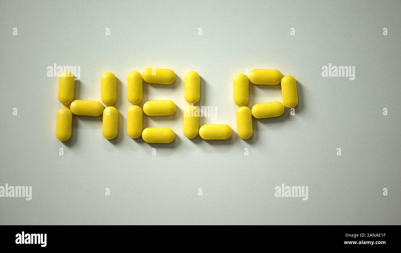 Help word made of pills on table, international illness awareness ...