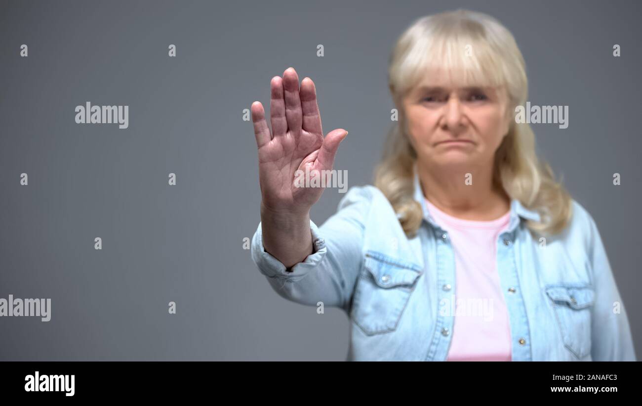 Stop sign woman senior hi-res stock photography and images - Alamy