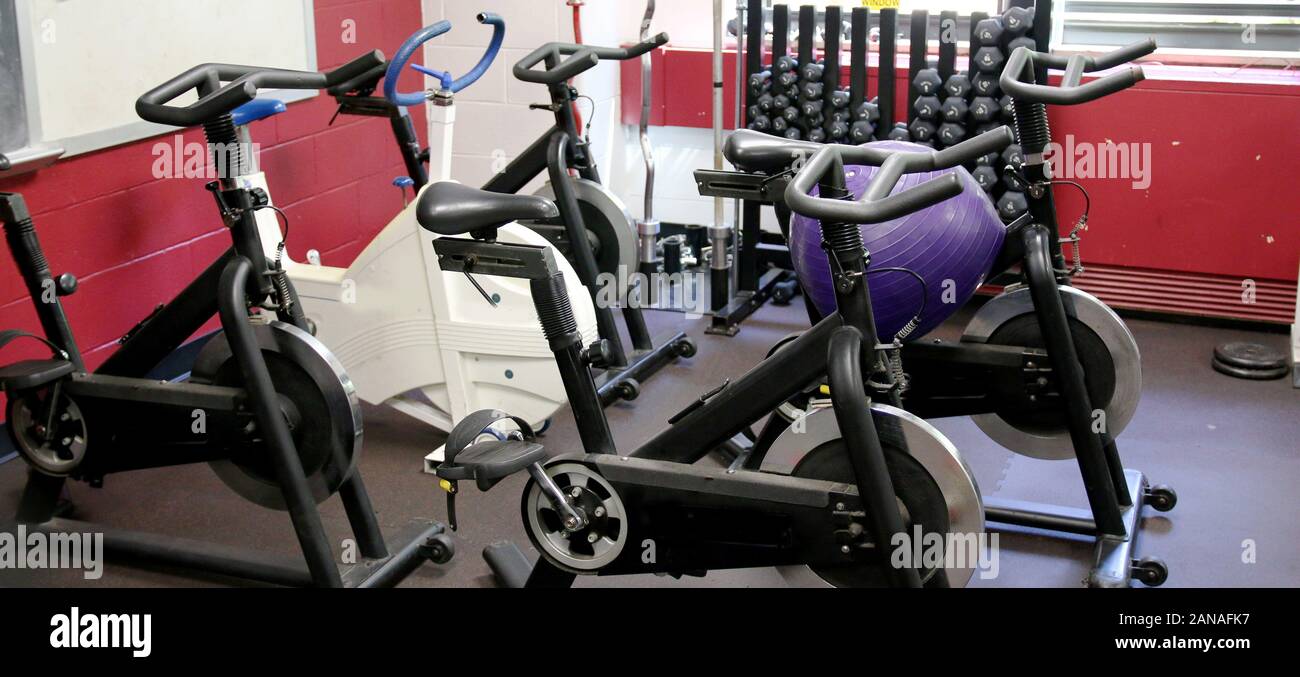 Stationary bikes and weights and other workout equipment Stock Photo ...