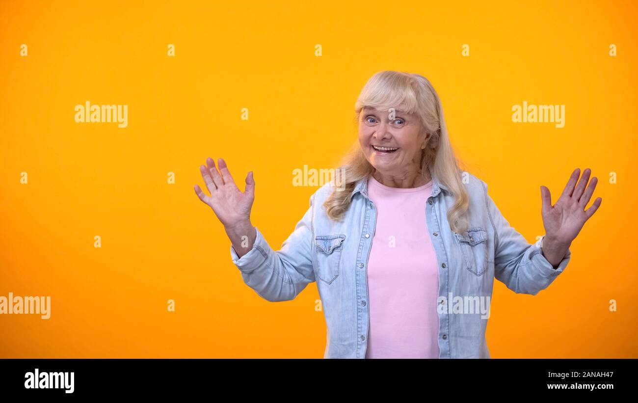 Extremely excited old lady posing on camera, happy with life after ...
