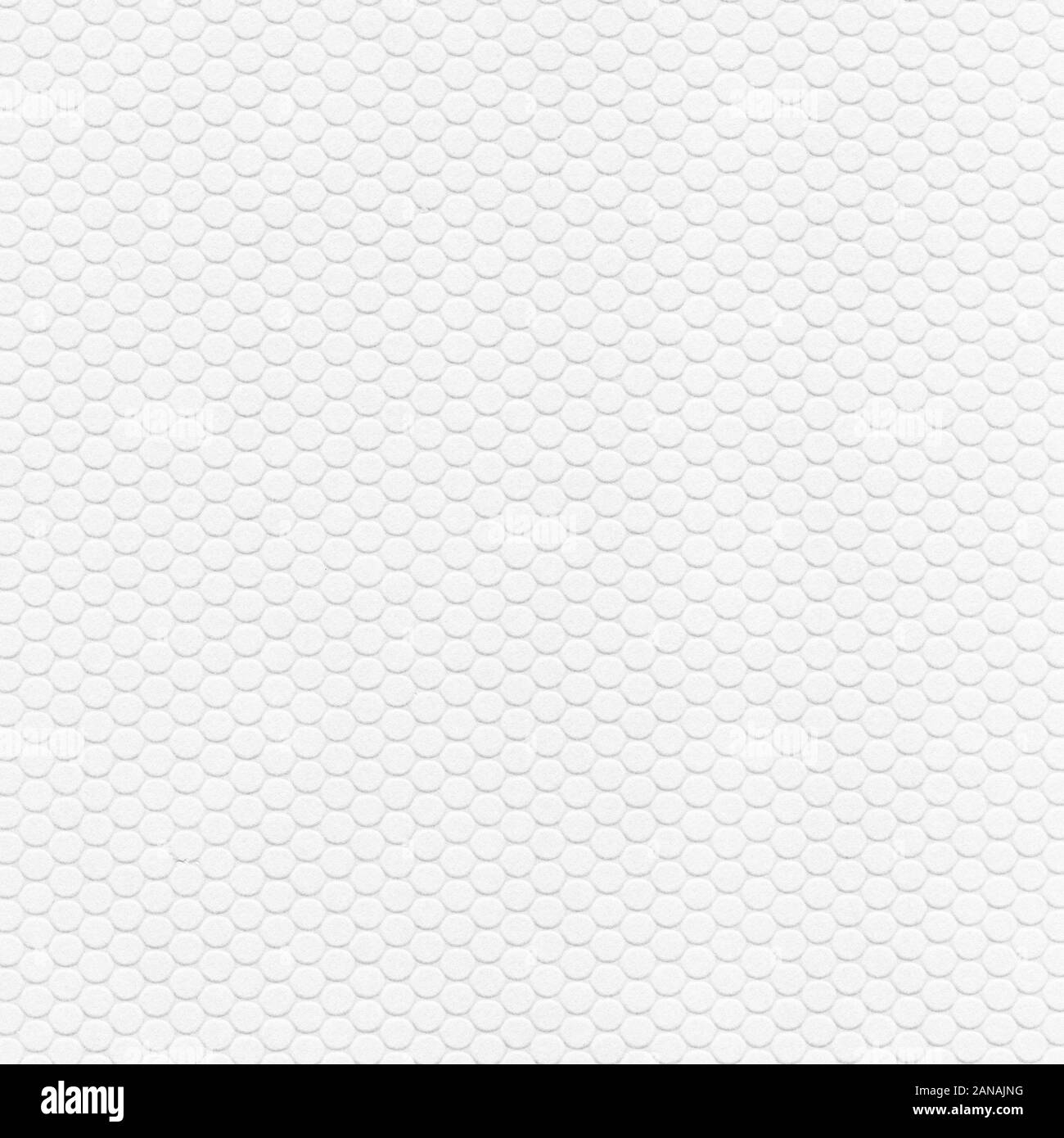 A large number of round-shaped geometric shapes are placed on the white ...