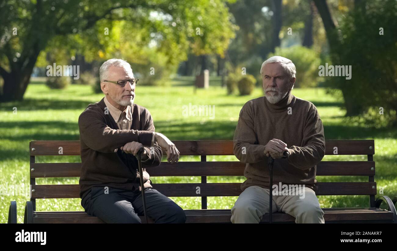 Two old men talking in park hi-res stock photography and images - Alamy