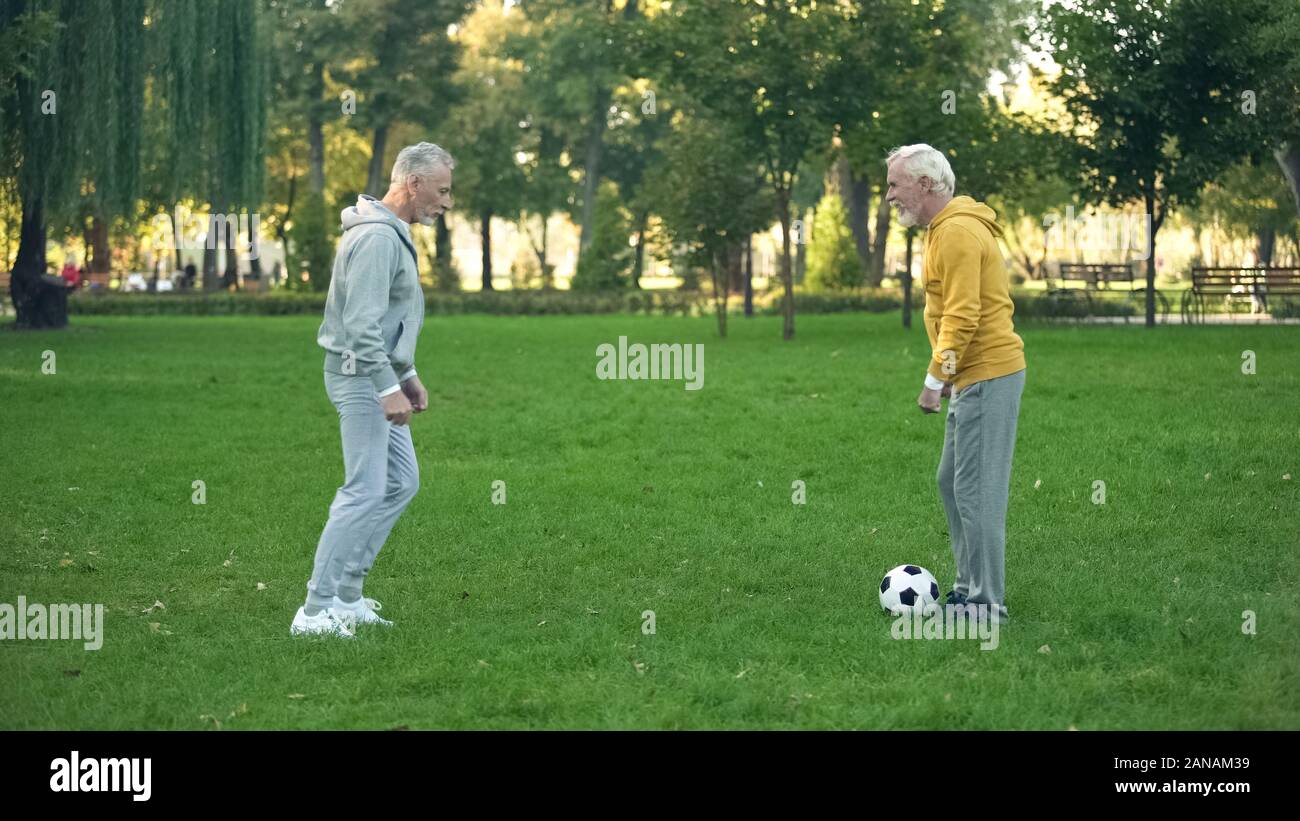 Old men playing soccer hi-res stock photography and images - Alamy