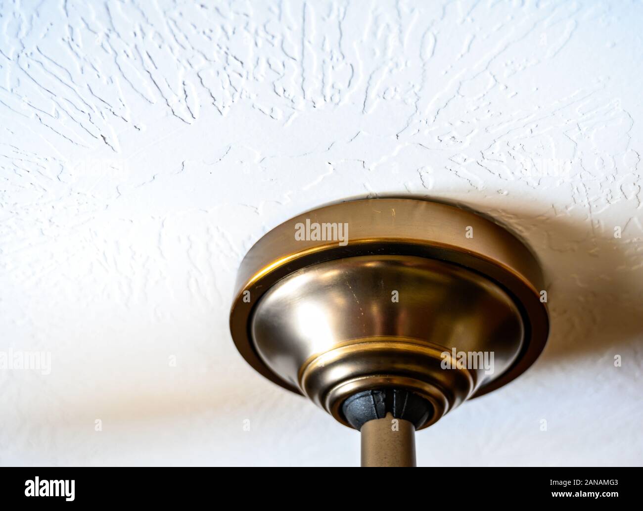 Mounting point of a ceiling fan on textured drywall Stock Photo - Alamy