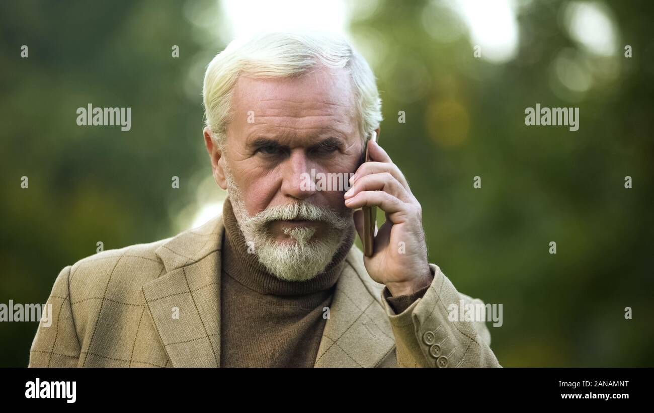Elderly telephone unhappy hi-res stock photography and images - Alamy