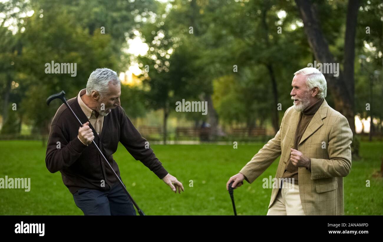 Two senior men with walking sticks hi-res stock photography and images ...