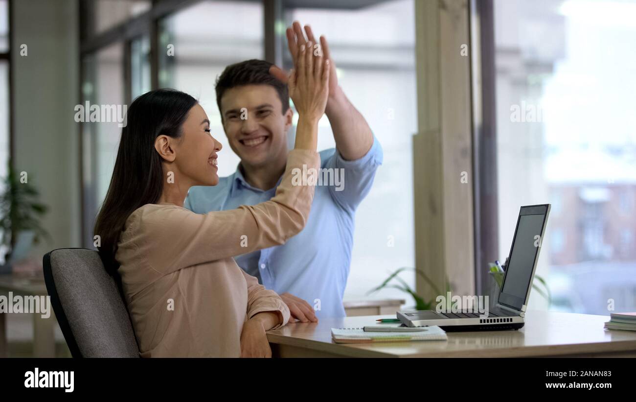 Businessman giving high five hi-res stock photography and images - Alamy