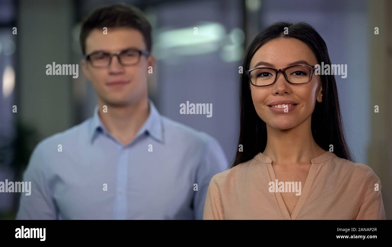 Confident professional office workers smiling on camera, business ...