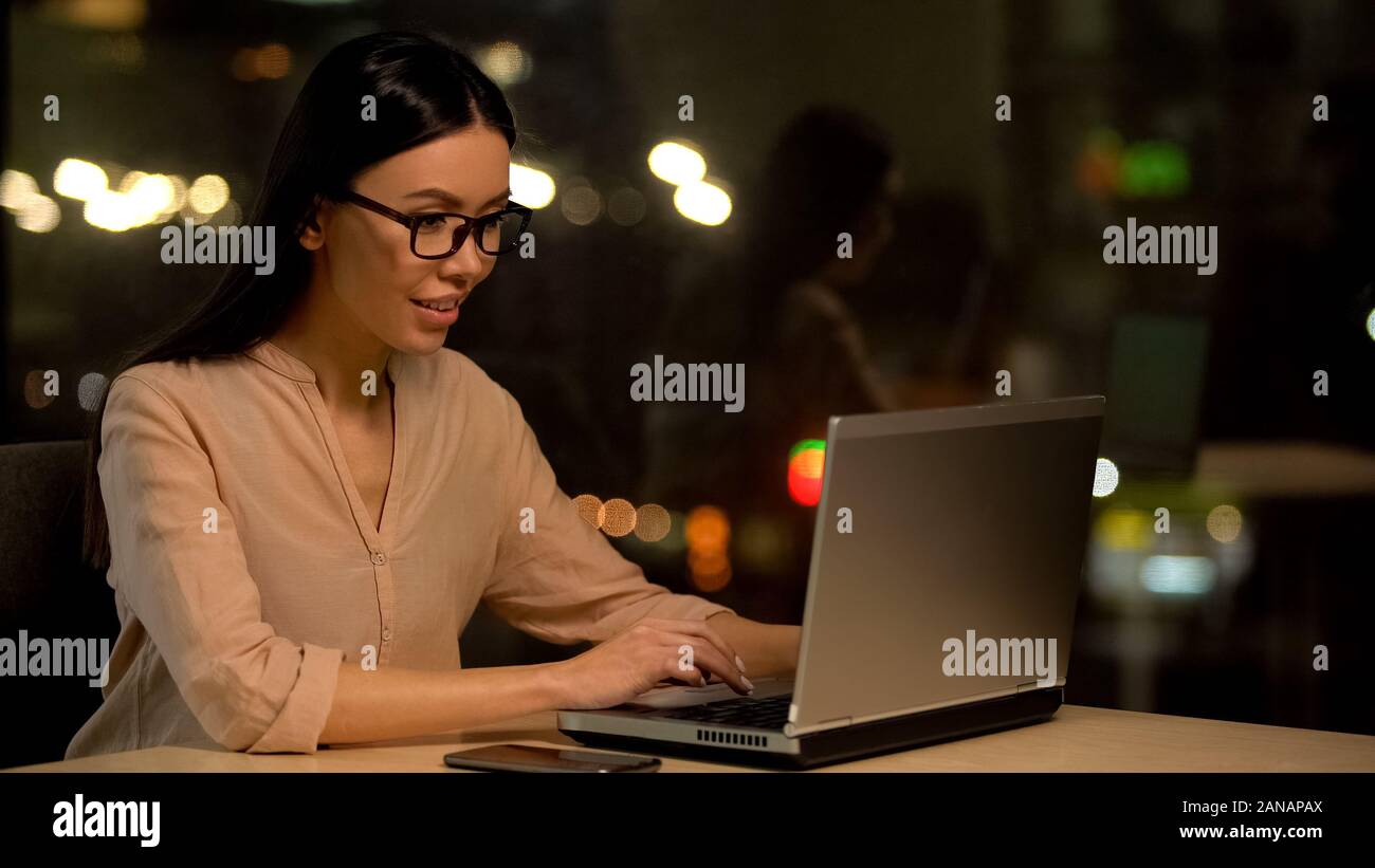 Professional journalist typing article on hi-res stock photography and ...