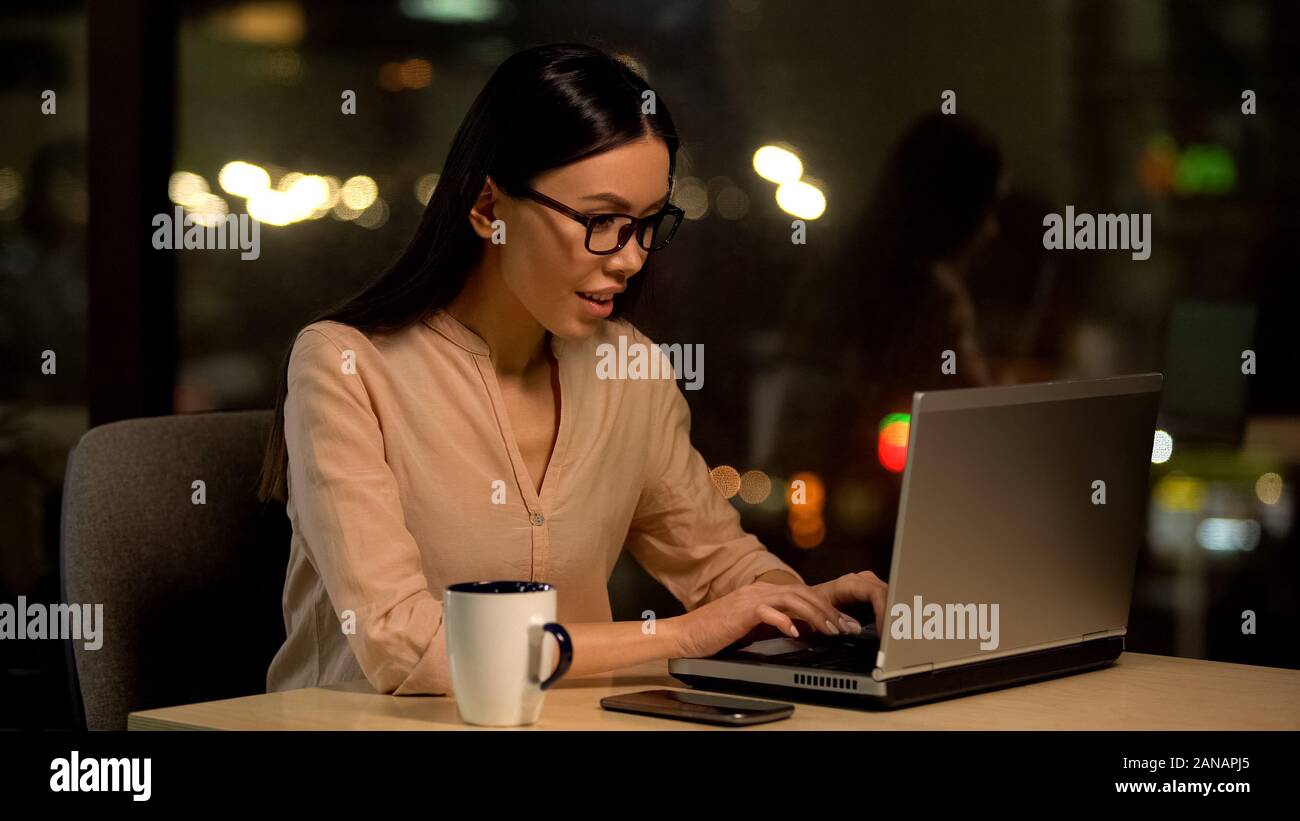 Inspired female freelancer editing project on laptop, reporter typing ...