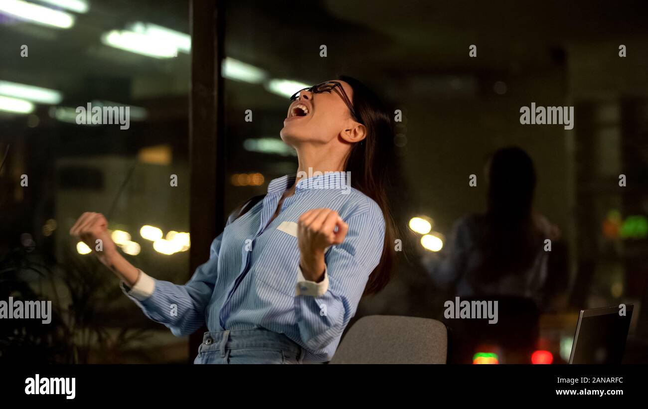 Excited lady showing success gesture in office, startup achievement ...
